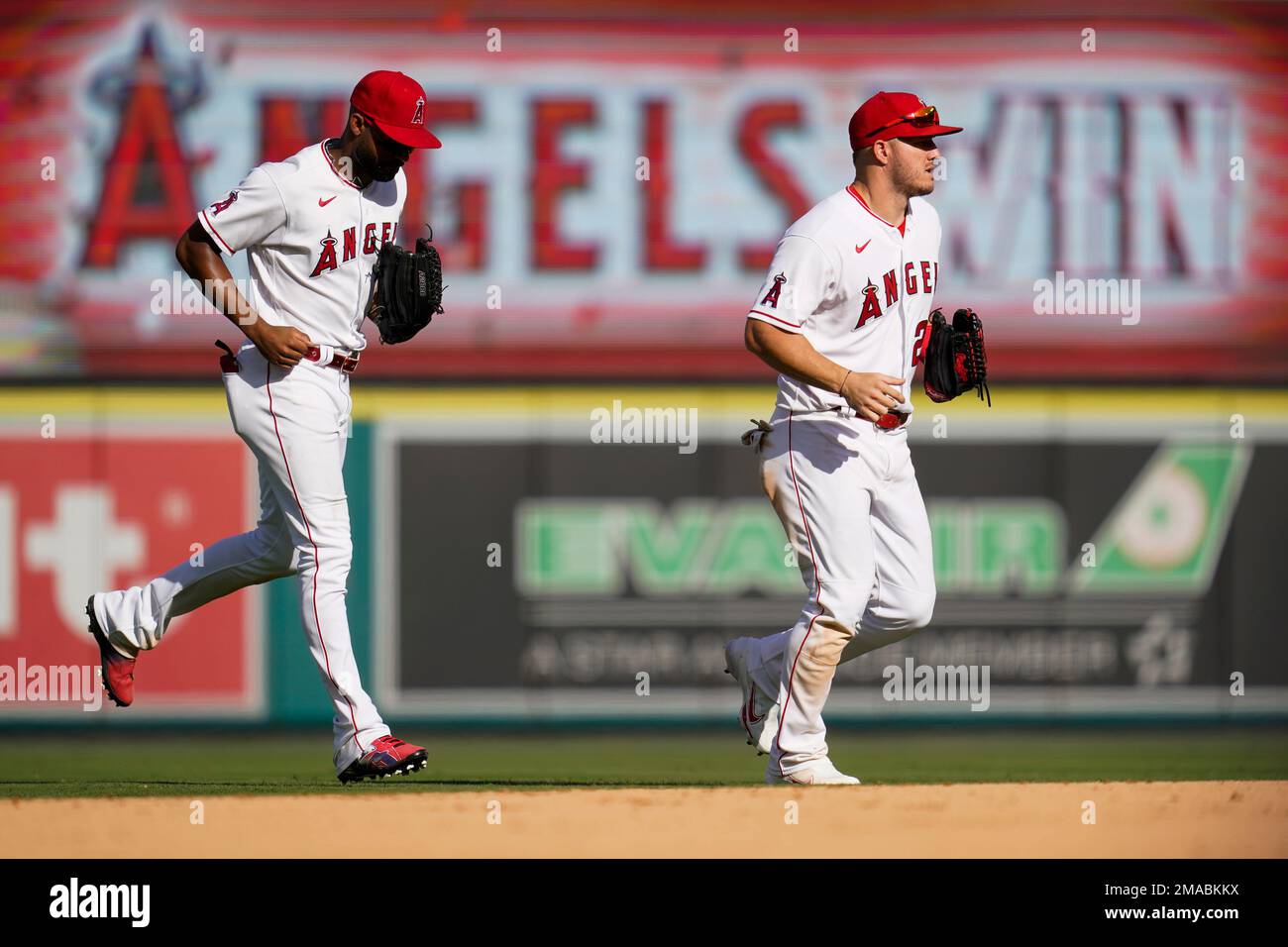 Los Angeles Angels left fielder Jo Adell, left, and center fielder Mike ...