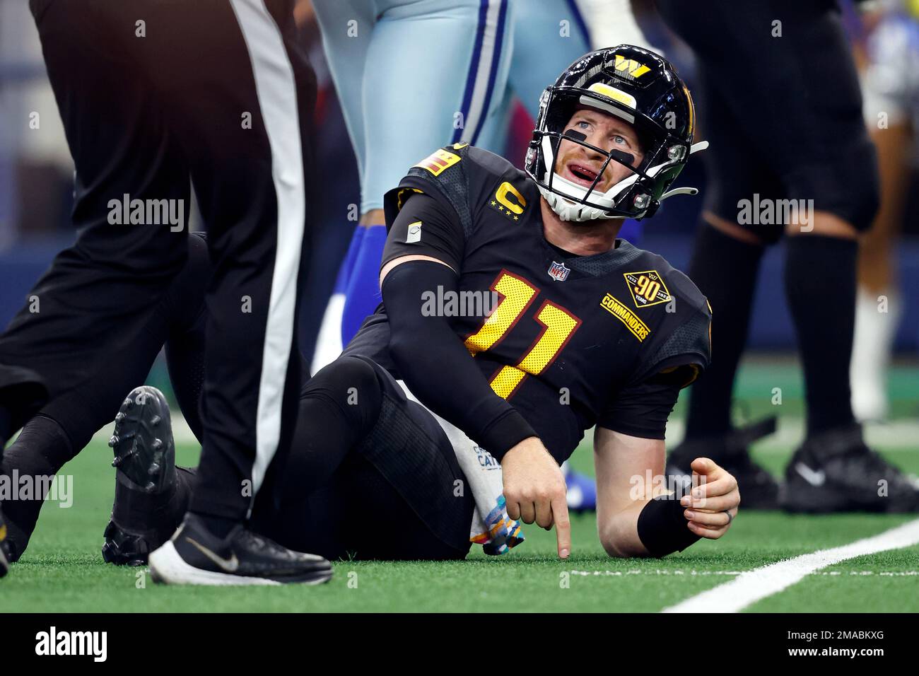 Washington Commanders quarterback Carson Wentz (11) reacts after being ...