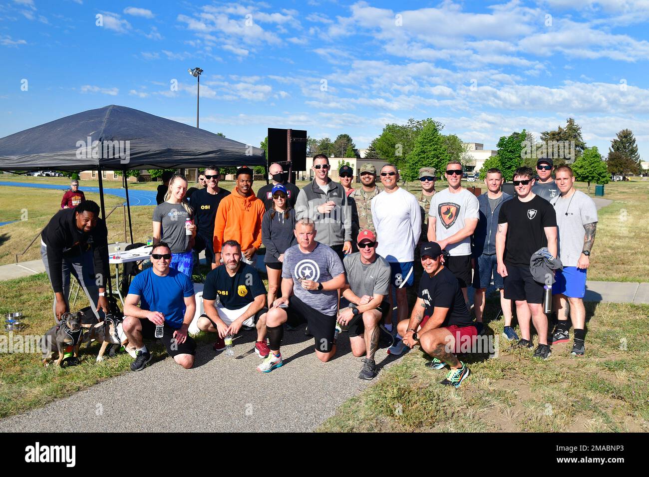 Participants in the 5K run/walk pose for a photo during National Police ...