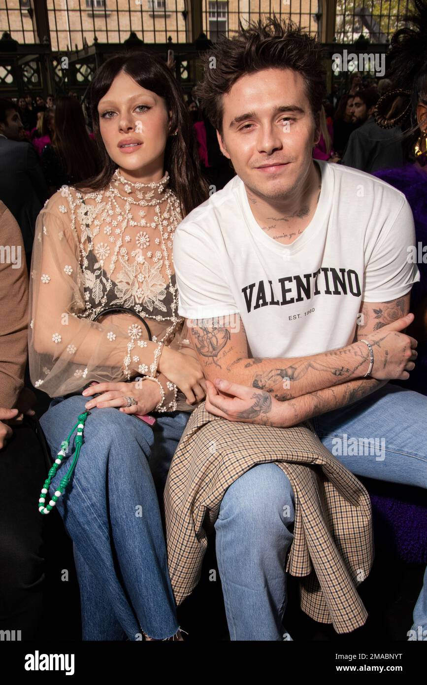 Nicola Peltz Left And Brooklyn Beckham Pose For A Photographer Upon
