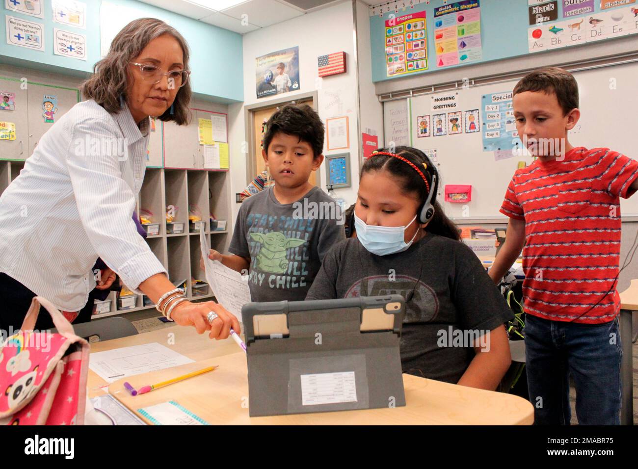 Teacher Arleen Franklin explains a math lesson to her students at Judy Nelson Elementary School ...