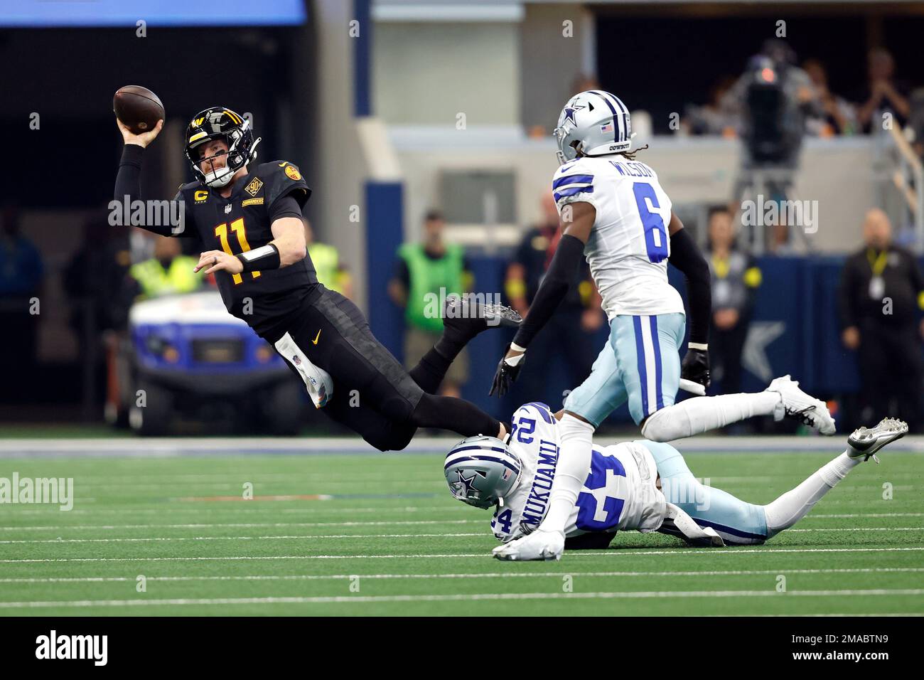 Washington Commanders quarterback Carson Wentz (11) throws the ball ...
