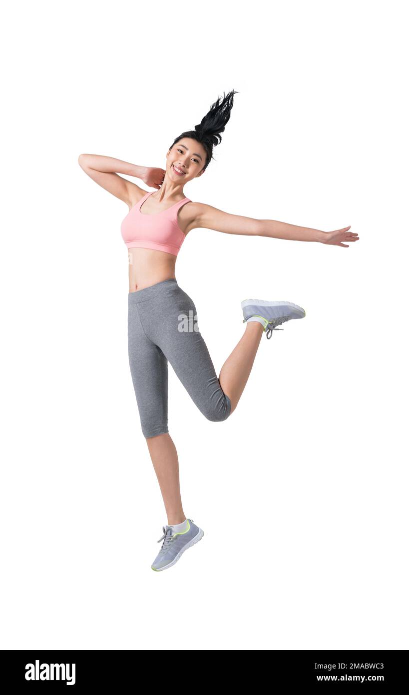 A young woman leaps Stock Photo - Alamy