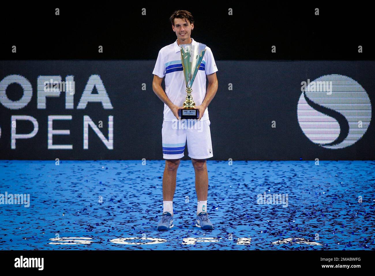 Switzerland's Marc-Andrea Huesler holds the trophy after winning the ...