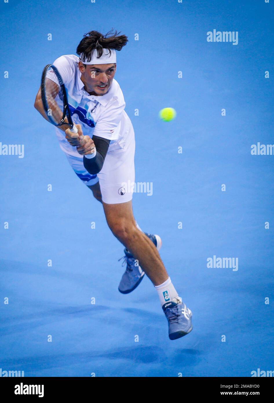 Switzerland's Marc-Andrea Huesler returns a shot during his match ...