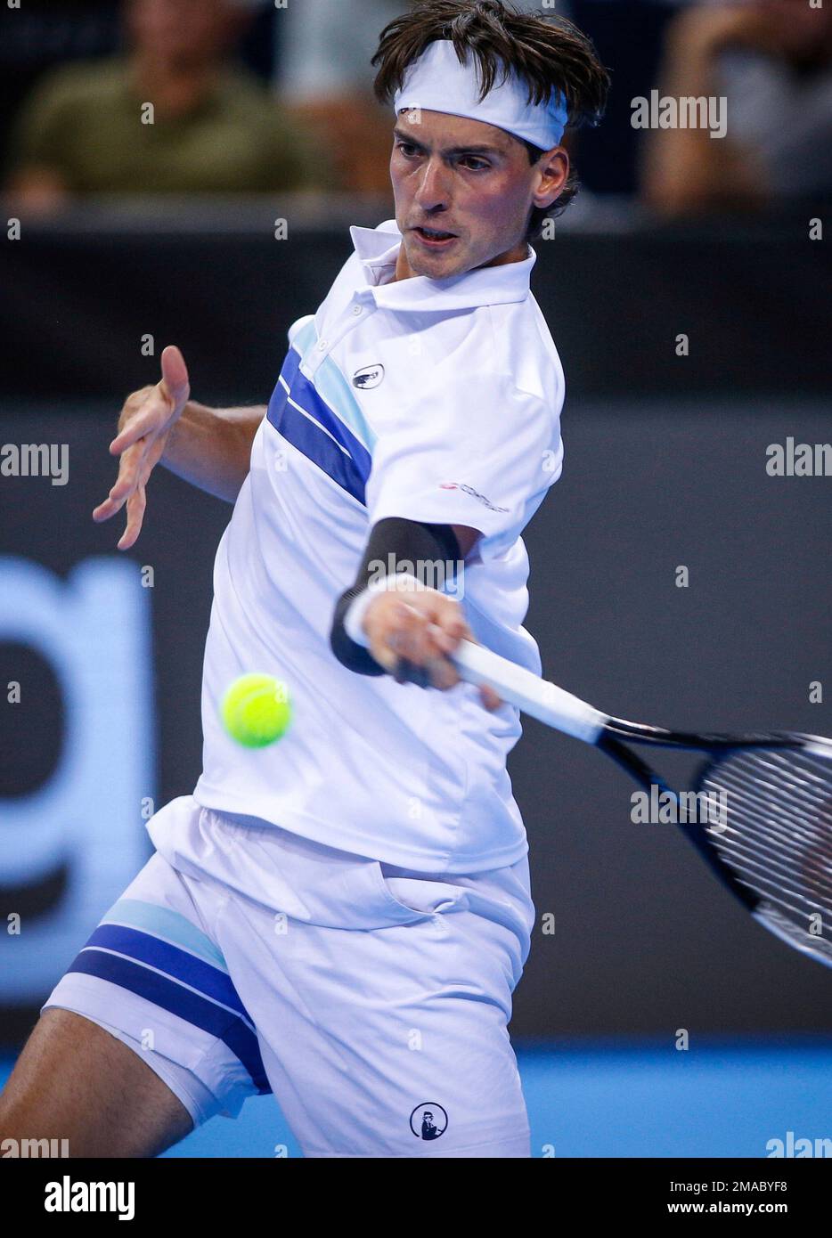 Switzerland's Marc-Andrea Huesler returns a shot during his match ...