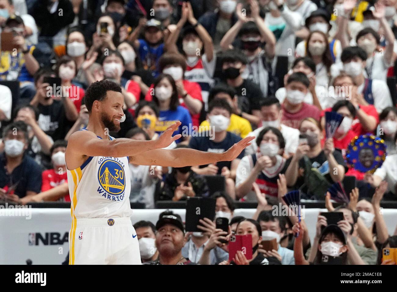 Golden State Warriors' Stephen Curry greets the spaectators prior to a preseason NBA basketball ...