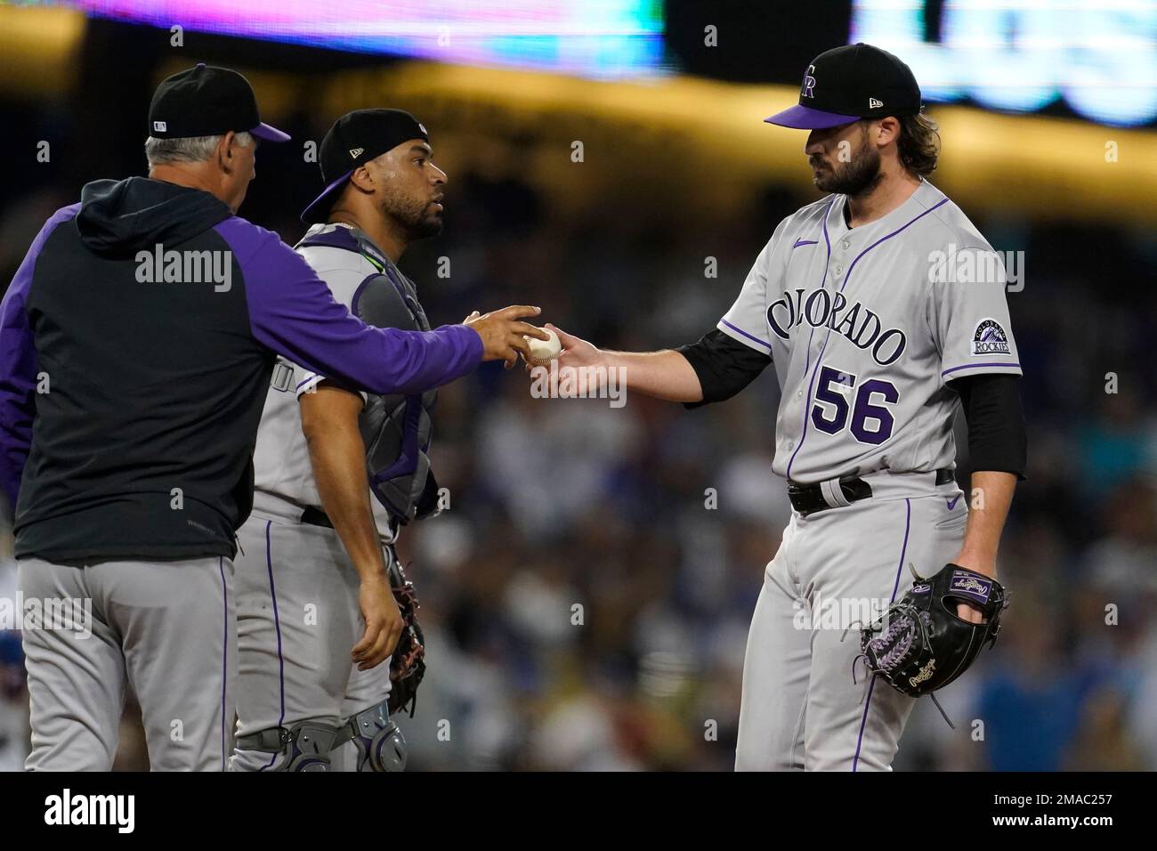 Colorado Rockies relief pitcher Chad Smith (56) is replaced by manager ...