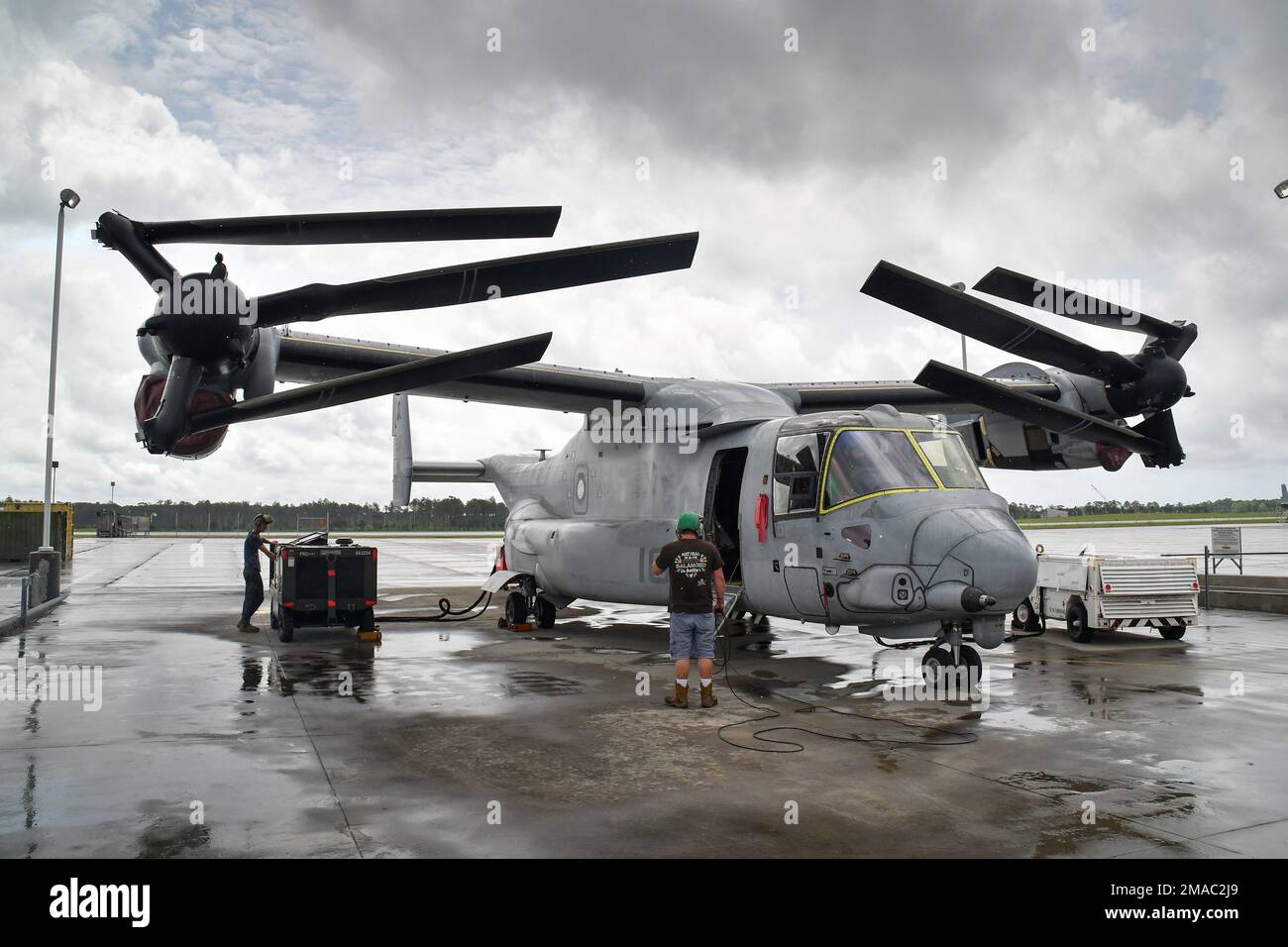 Fleet Readiness Center East (FRCE) artisans transport an MV-22 Osprey ...