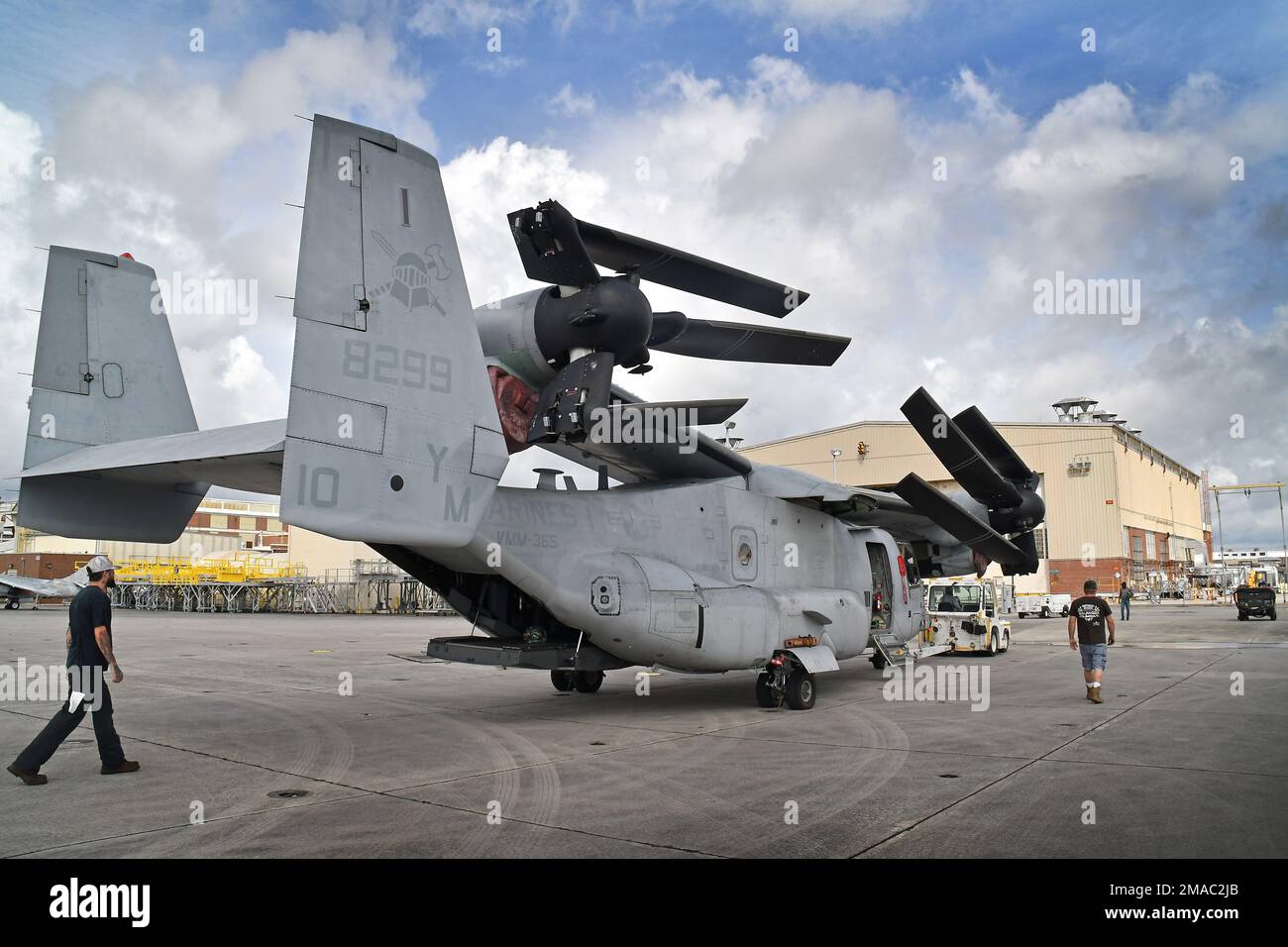 Fleet Readiness Center East (FRCE) artisans transport an MV-22 Osprey ...
