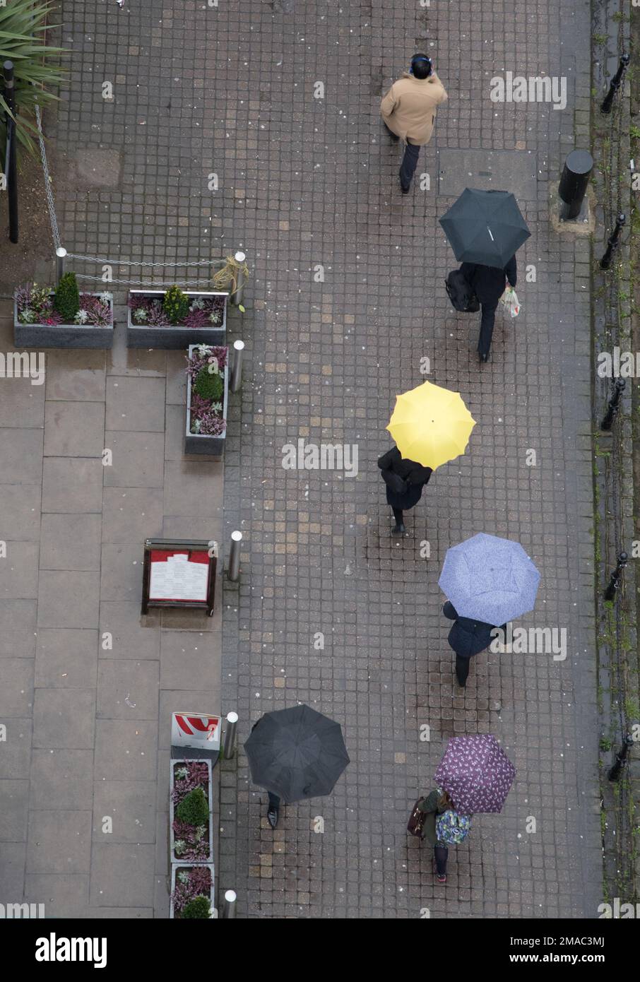 Group of unrecognised people with umbrella walking in the rain. Rush ...