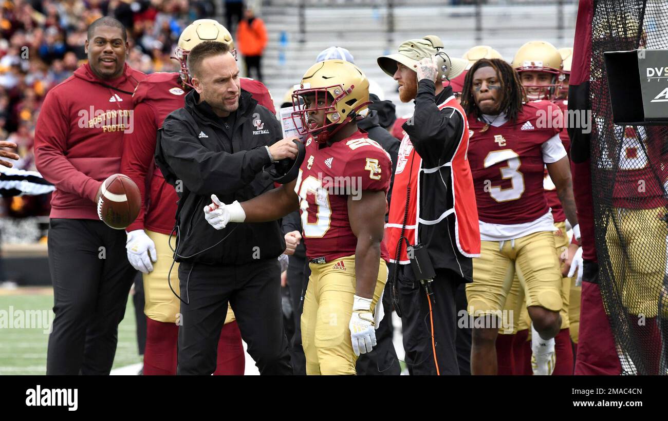 Boston College head coach Jeff Hafley speaks with runningback Alex ...