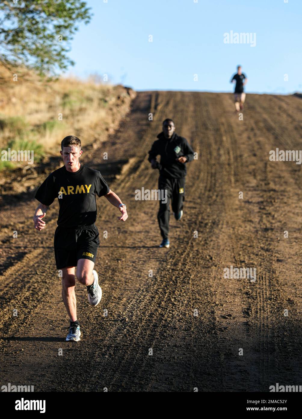 Soldiers assigned to the 4th Infantry Division run downhill on the ...