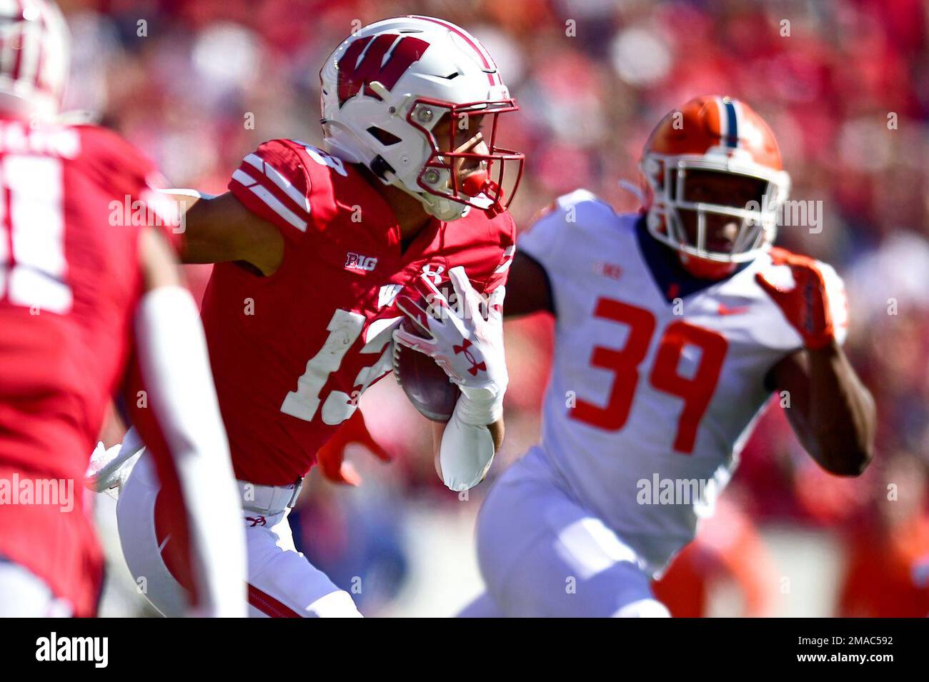 Wisconsin wide receiver Chimere Dike (13) runs the ball against ...
