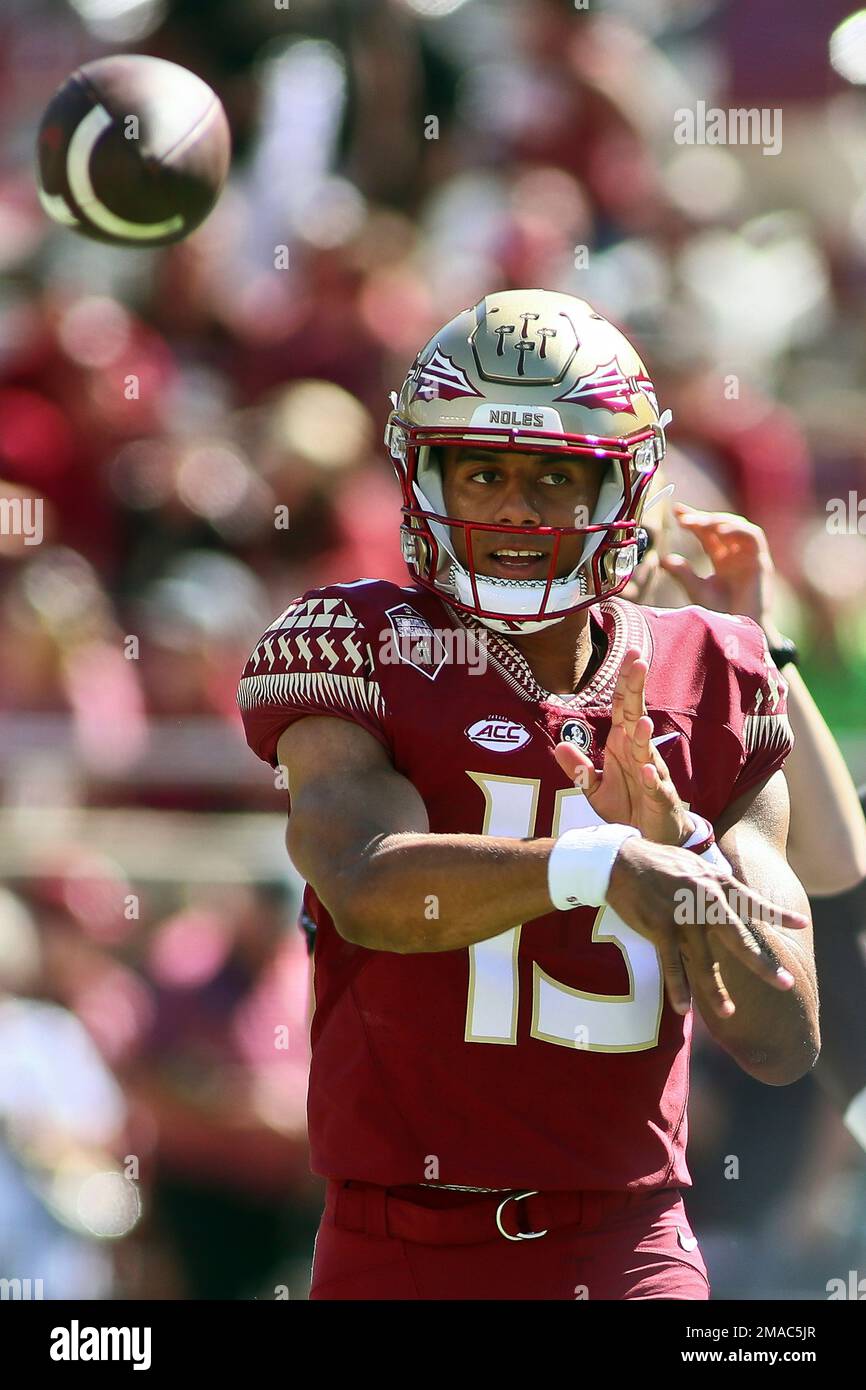 Florida State quarterback Jordan Travis (13) warms up before an NCAA ...