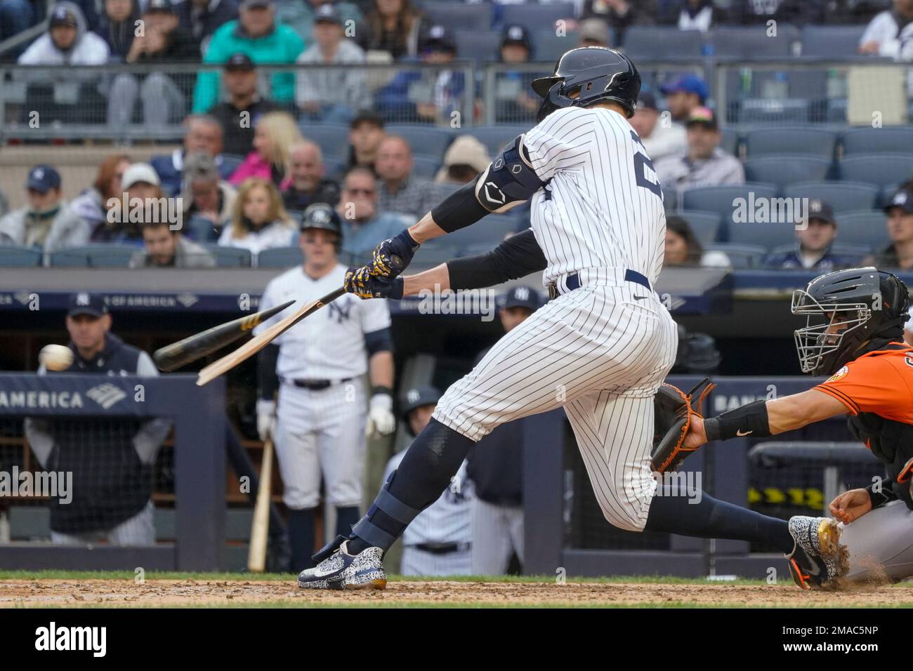 New York Yankees' Giancarlo Stanton breaks his bat hitting a single in ...
