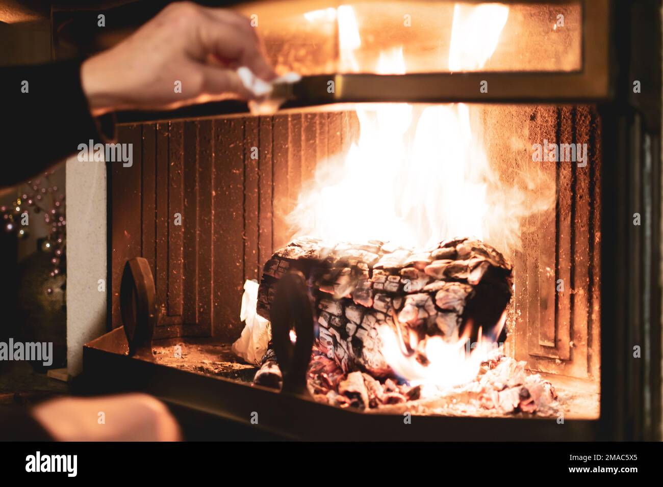 Log of wood burning in a fireplace inside a house, hearth Stock Photo ...