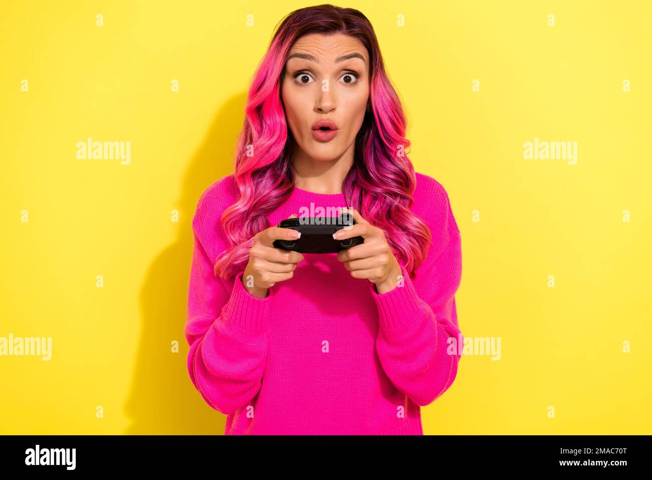 Portrait of impressed addicted lady gamer pouted lips playing video ...