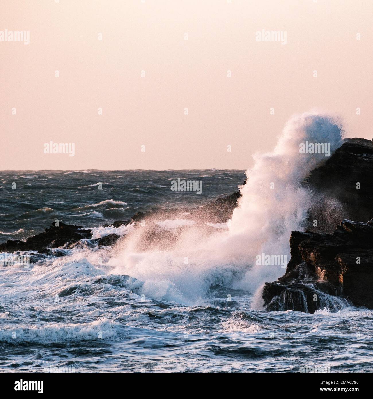 Waves crashing against the rocks Stock Photo - Alamy