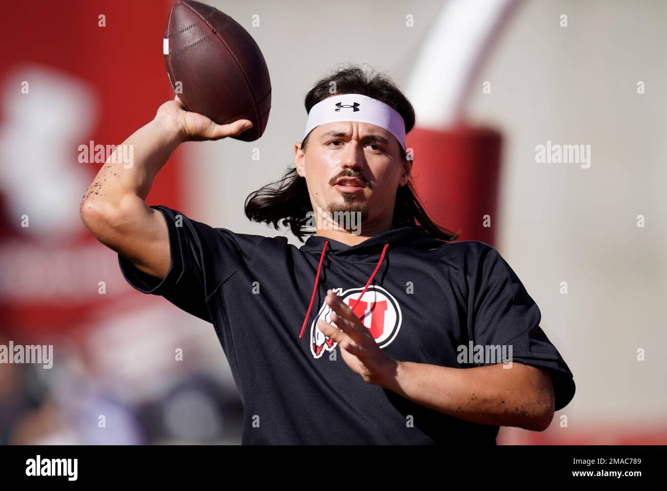 Utah quarterback Cameron Rising (7) warms up before the start of their ...