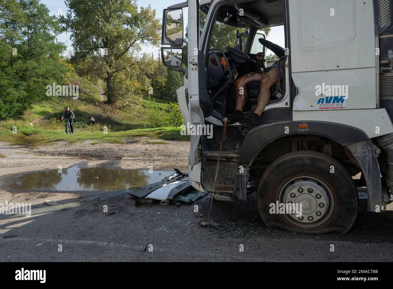 EDS NOTE: GRAPHIC CONTENT - The dead body of a driver is seen inside ...