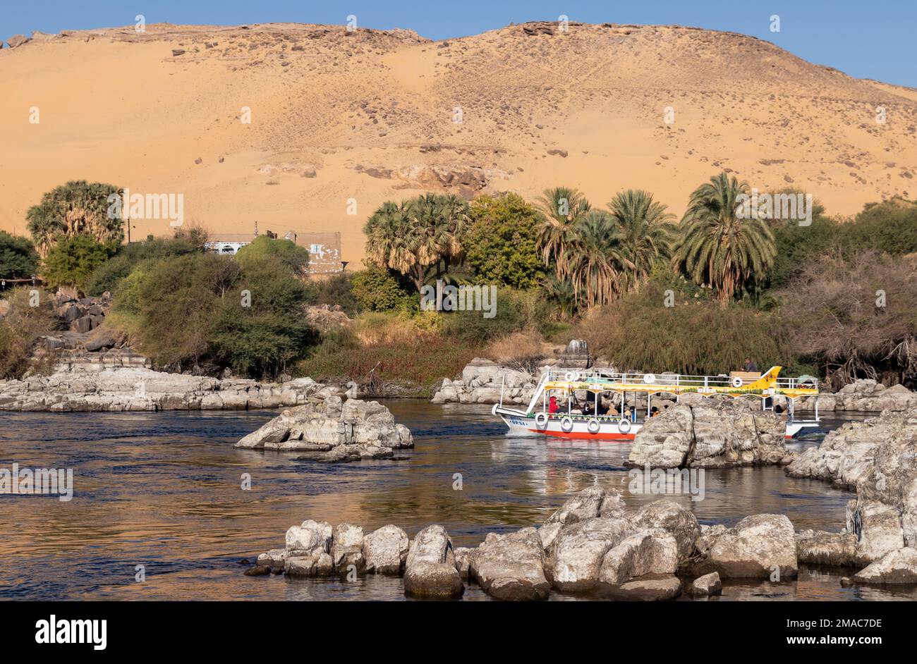Beautiful sandy landmark of faluca traditional boat sailing in the Nile ...
