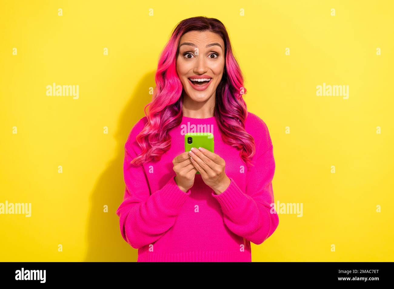 Photo of shocked positive youth lady use smart device receive web ...