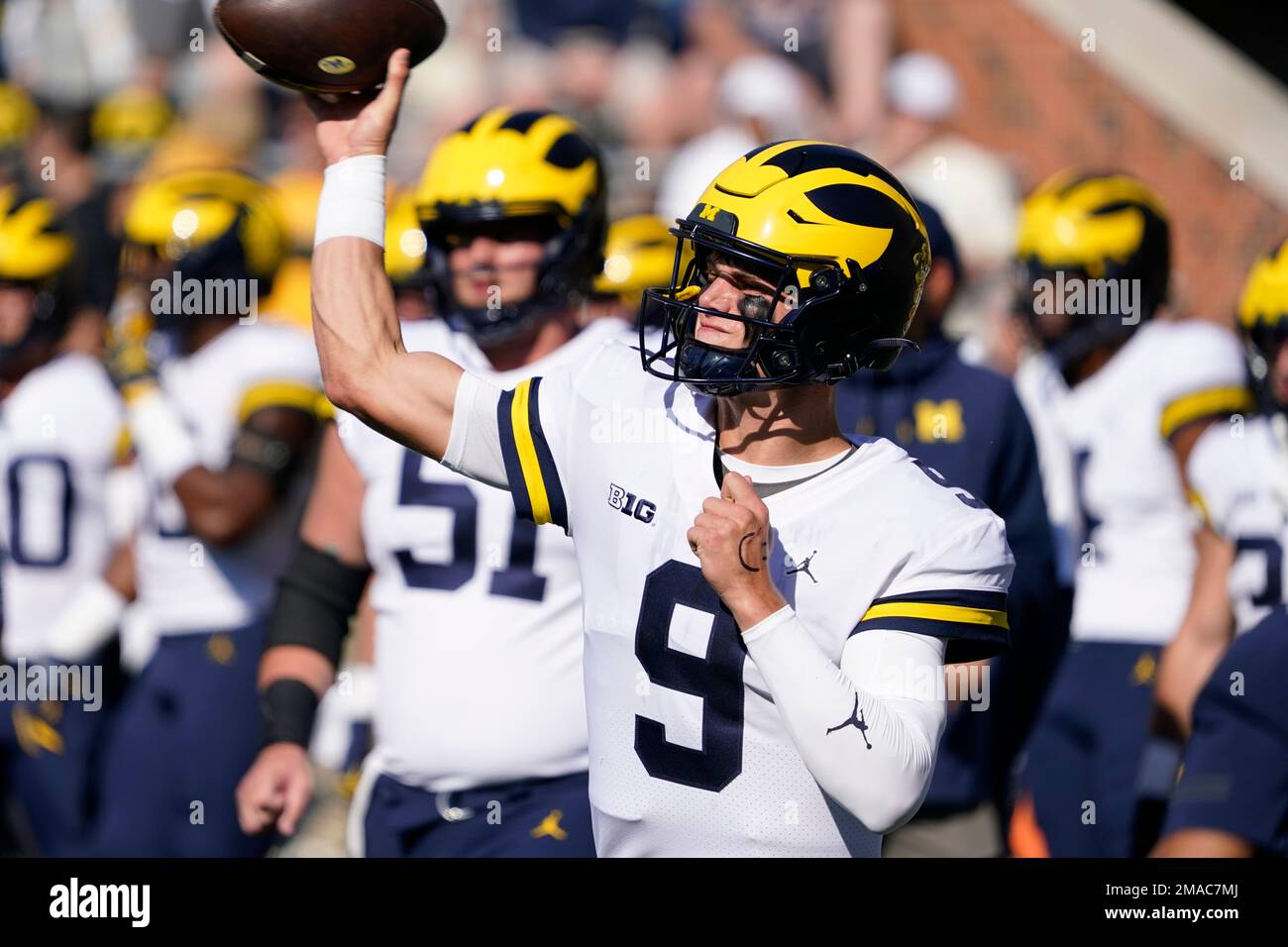 Michigan quarterback J.J. McCarthy warms up before an NCAA college ...