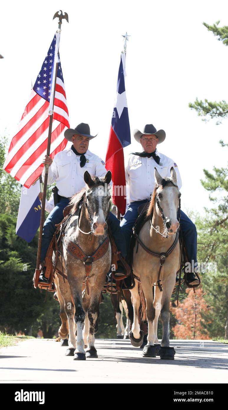 A mounted color-guard moves slowly toward their position for the ...