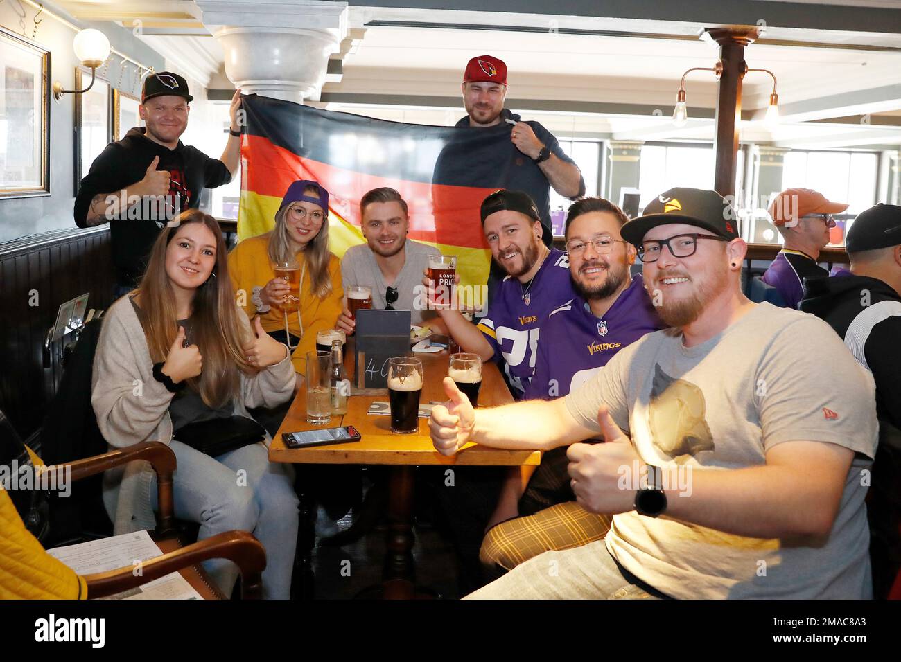 Fans pose for a photo at the Vikings pub event at The Barrow Boy ...