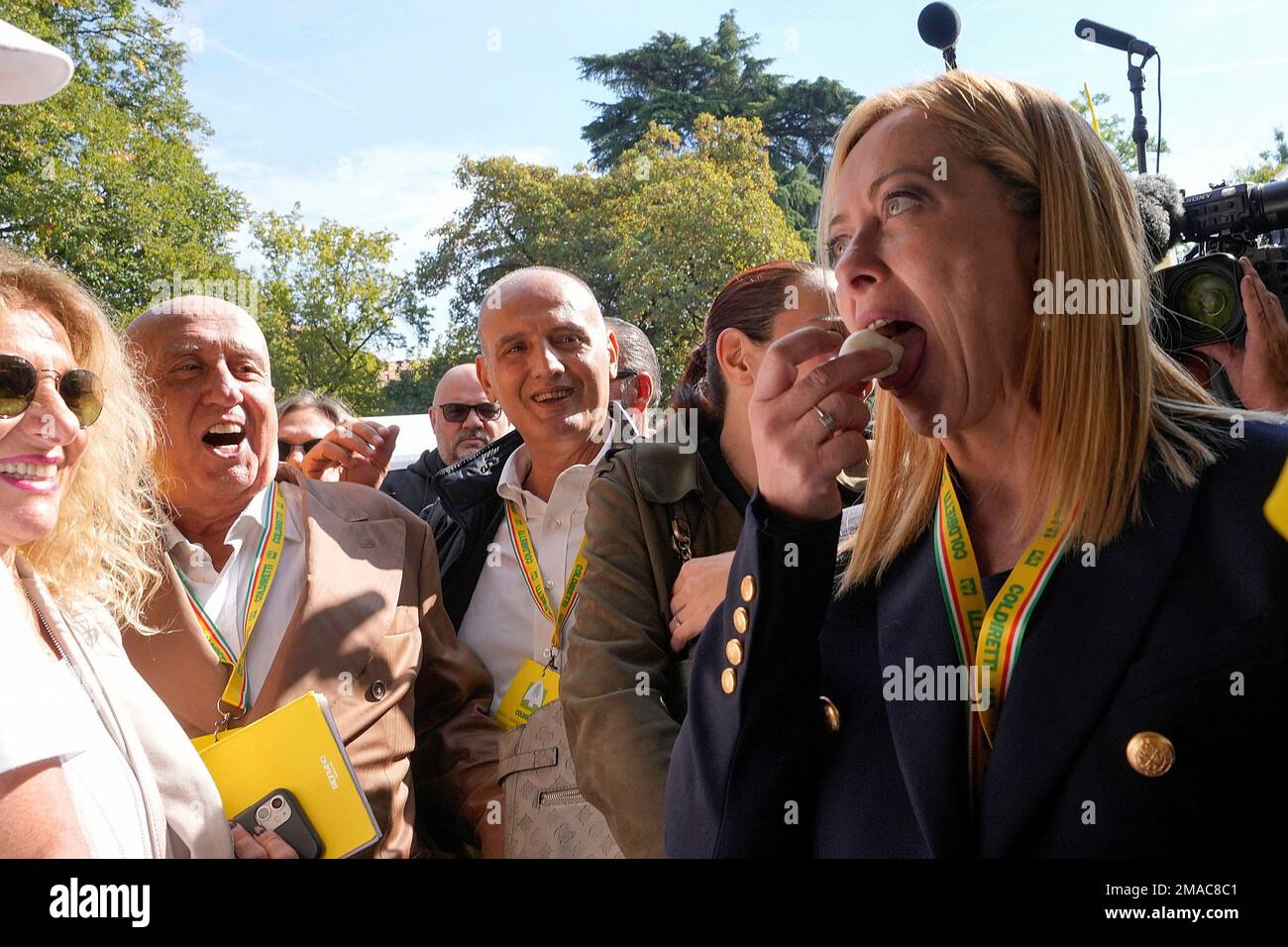 Brothers of Italy leader Giorgia Meloni tastes a piece of mozzarella at ...