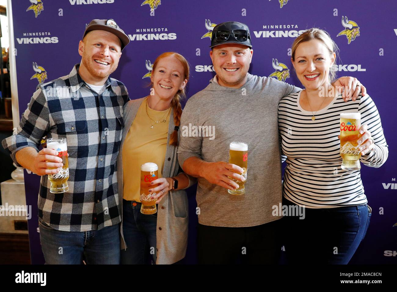 Fans pose for a photo at the Vikings pub event at The Barrow Boy ...