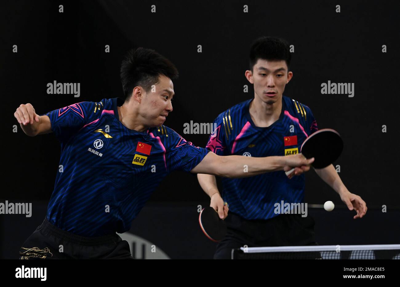 Doha, Qatar. 19th Jan, 2023. Yu Ziyang(L) /Zhou Kai of China compete ...
