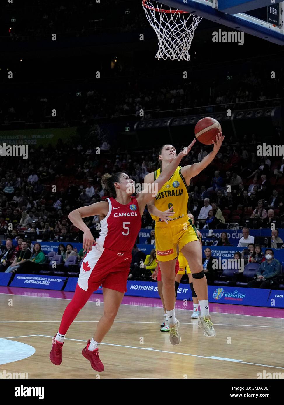 Australia's Steph Talbot, right, lays up around Canada's Kia Nurse ...