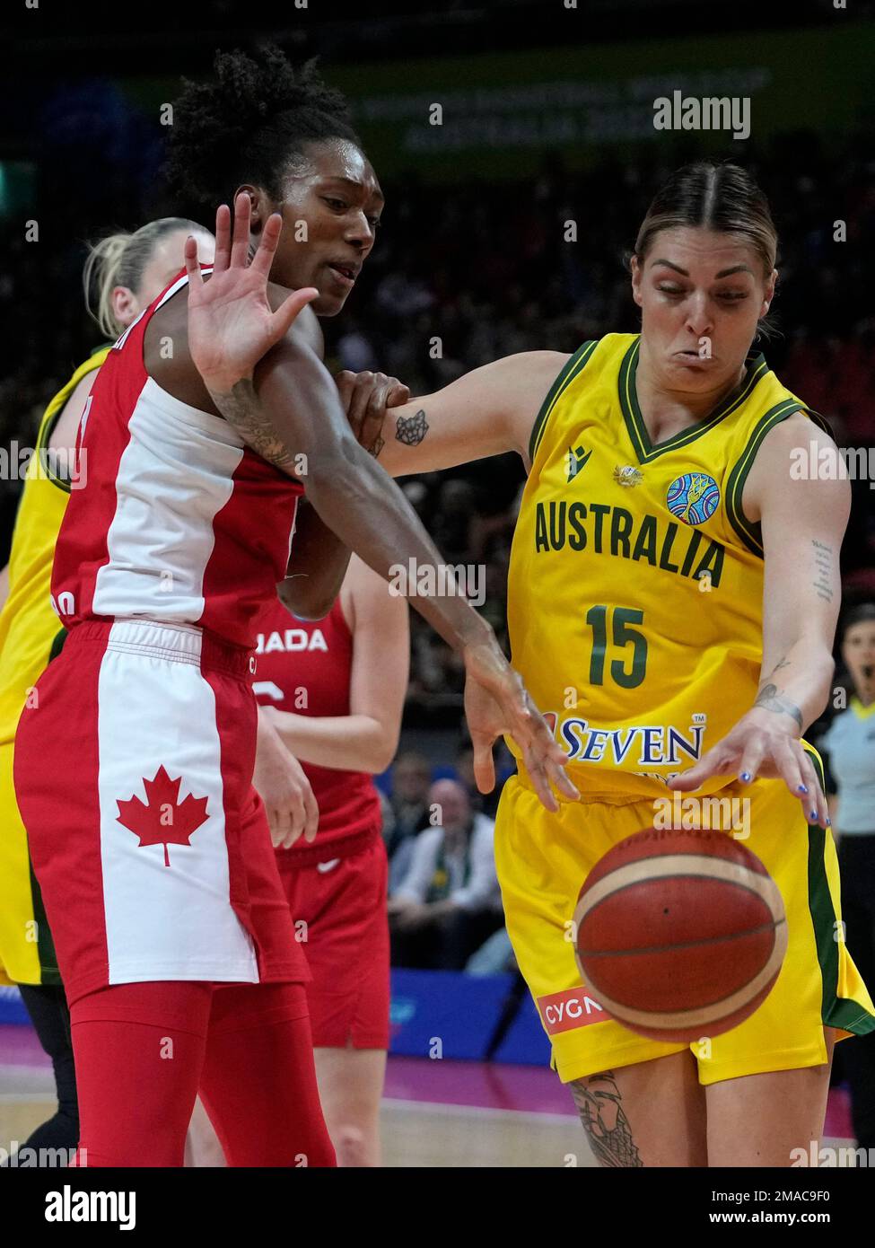 Australia's Cayla George, right, gets tangled with Canada's Kayla ...