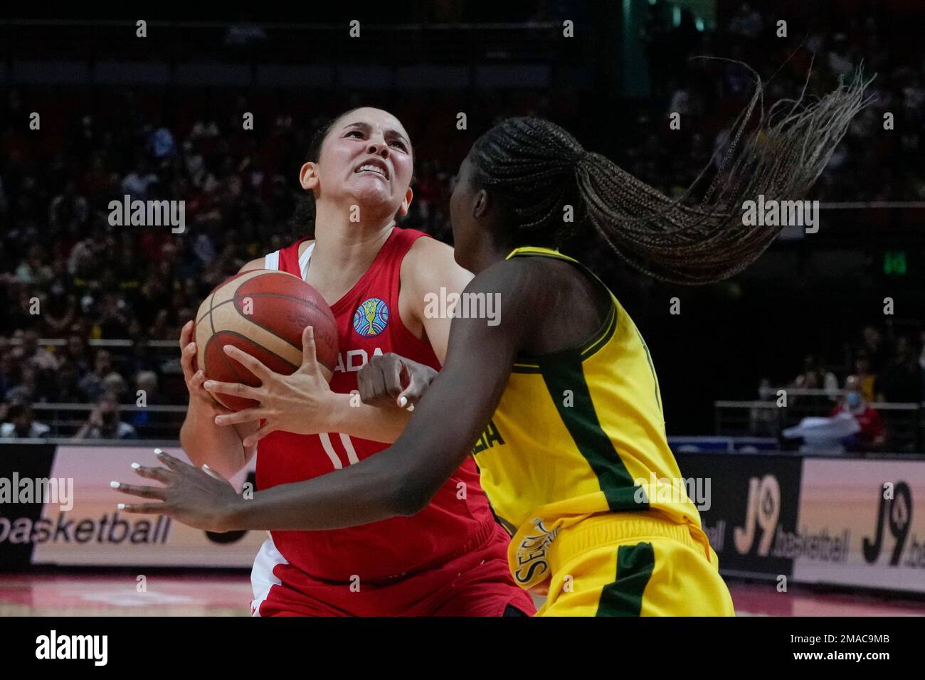 Canada's Natalie Achonwa attempts a shot on goal as Australia's Ezi ...