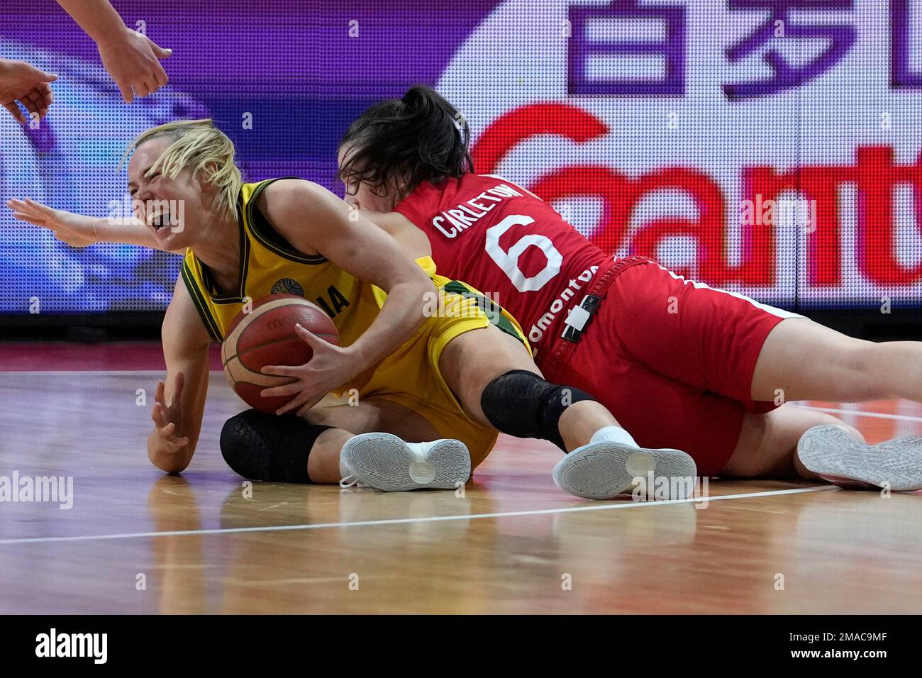 Australia's Tess Madgen, left, and Canada's Bridget Carleton scramble ...