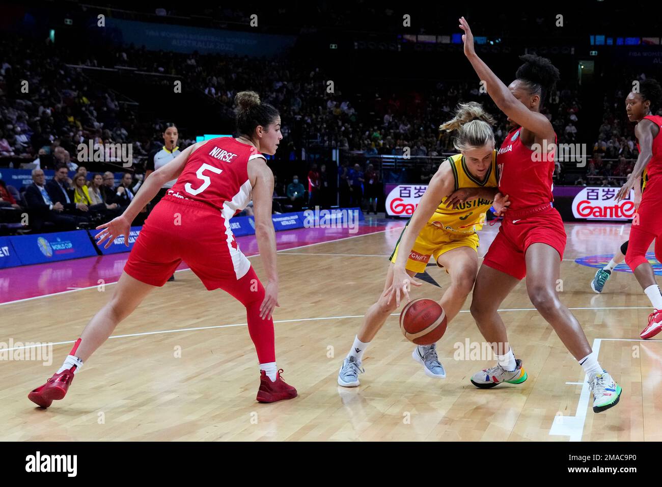 Australia's Kristy Wallace runs at Canada's Nirra Fields, right, and ...