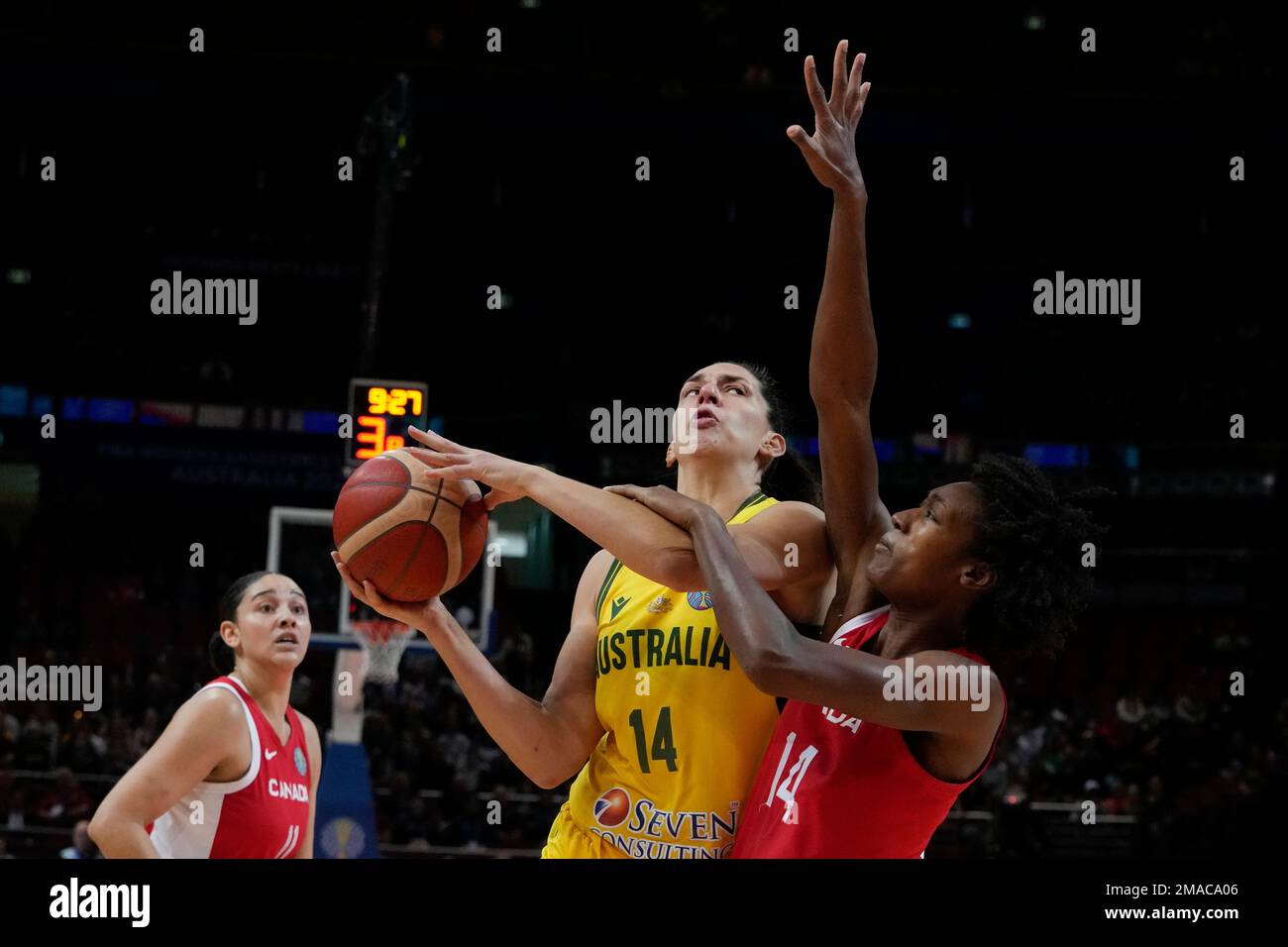 Australia's Marianna Tolo is fouled by Canada's Kayla Alexander, right ...
