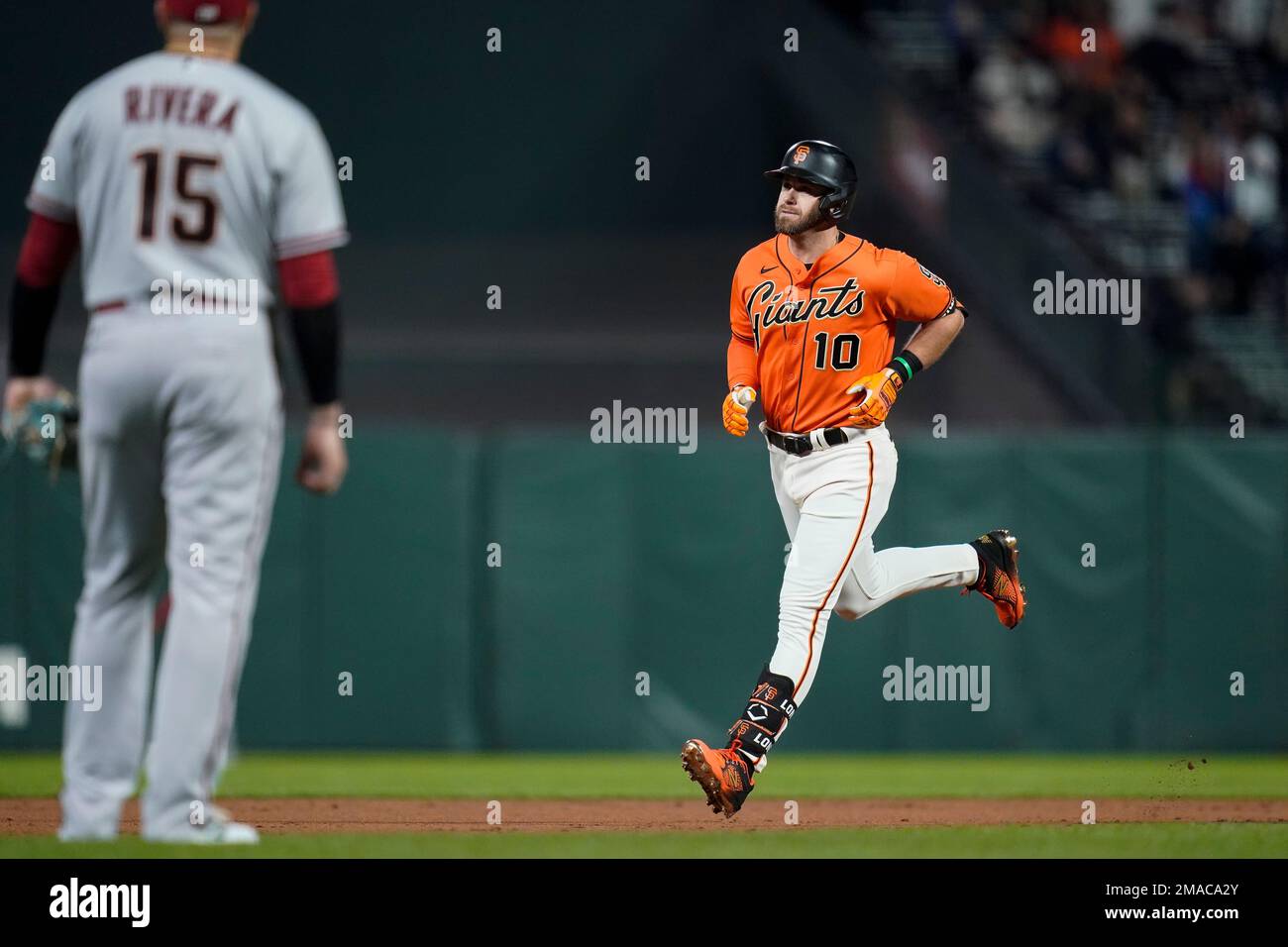 San Francisco Giants' Evan Longoria runs the bases after hitting a ...