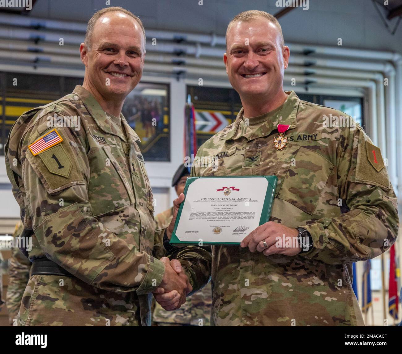 U.S. Army Maj. Gen. John V. Meyer III (left), the commanding general of the 1st Infantry ...