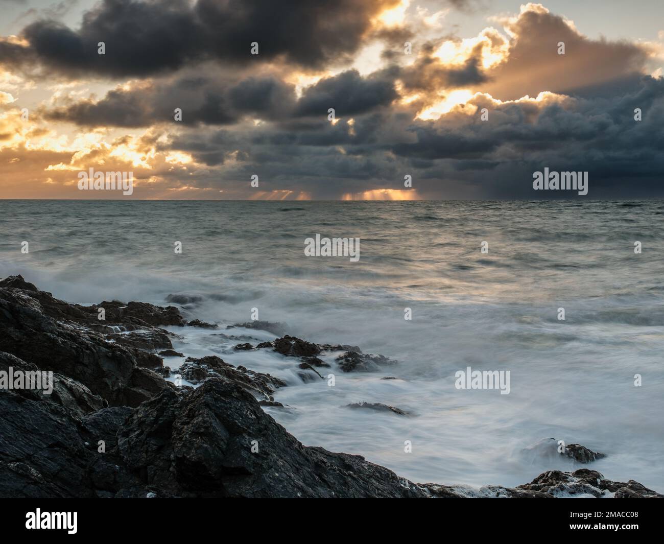 Dramatic coastal sunset at Rhosniegr on Anglesey, North Wales Stock ...