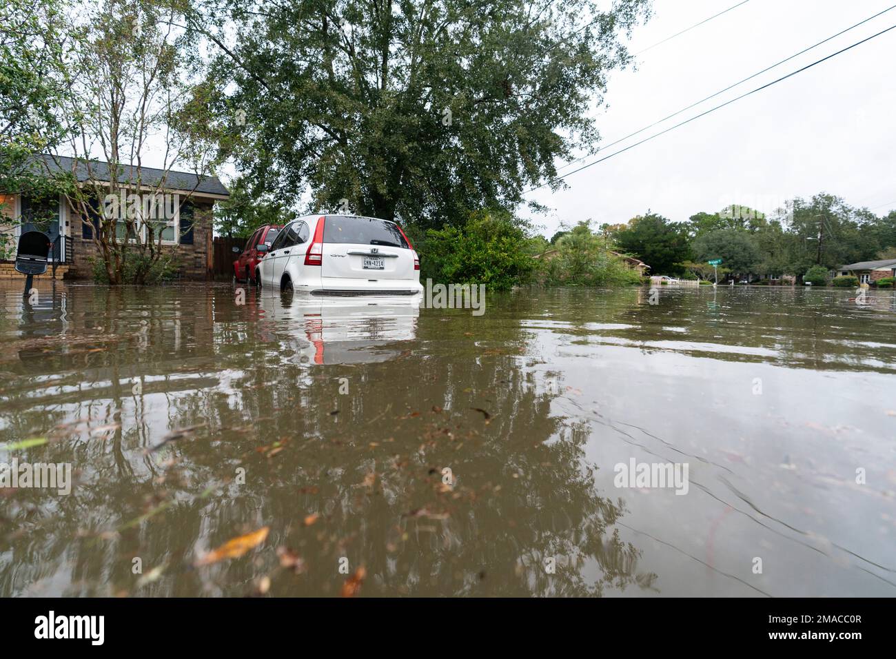 A car sits in floodwaters from Hurricane Ian, Friday, Sept. 30, 2022 ...