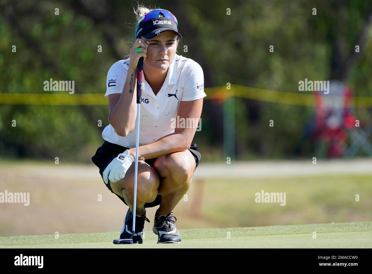 Lexi Thompson looks at her put line on the ninth green during the LPGA ...
