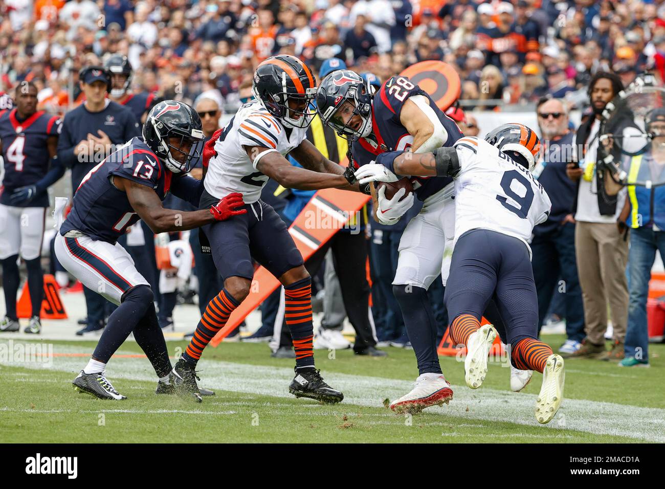 Chicago Bears safety Jaquan Brisker (9) tackles Houston Texans running ...
