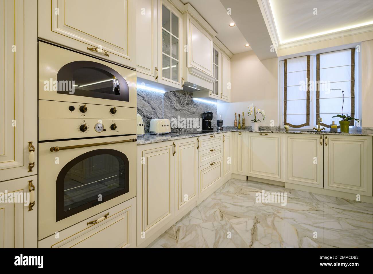 Closeup of classic cream-colored kitchen Stock Photo - Alamy