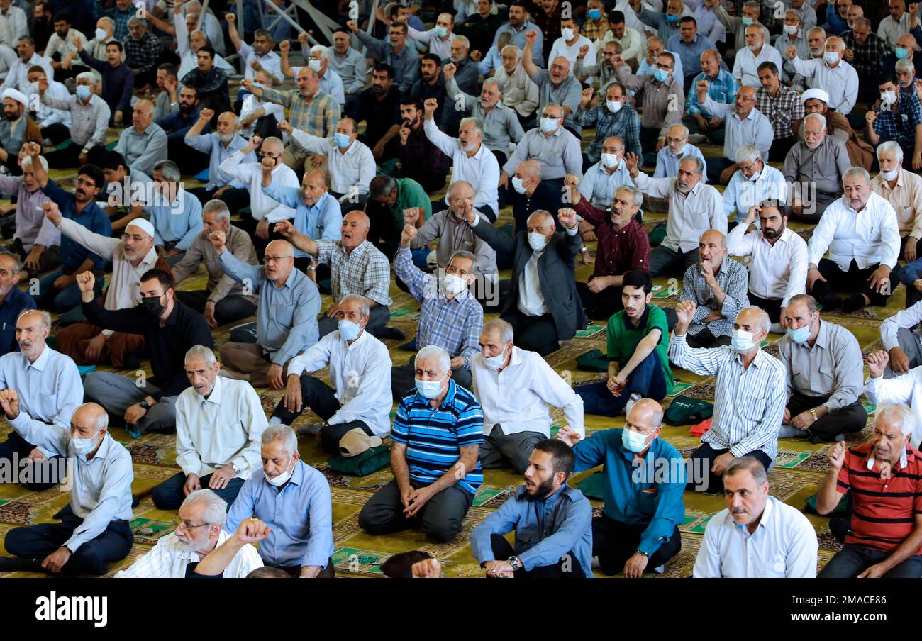 Iranian worshippers chant slogans during Friday prayers ceremony at ...