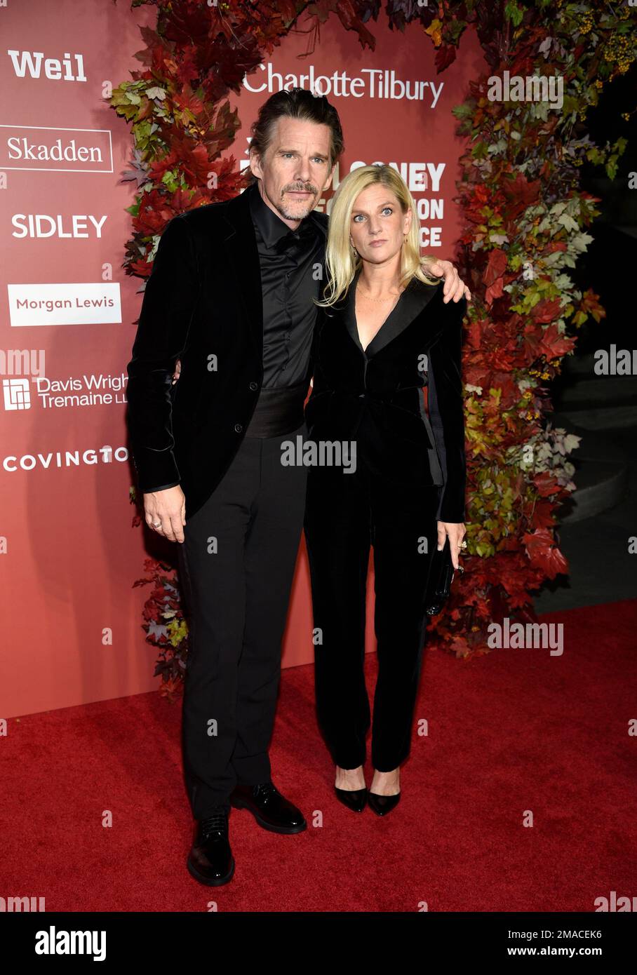 Ethan Hawke, left, and wife Ryan Hawke attend the Clooney Foundation ...