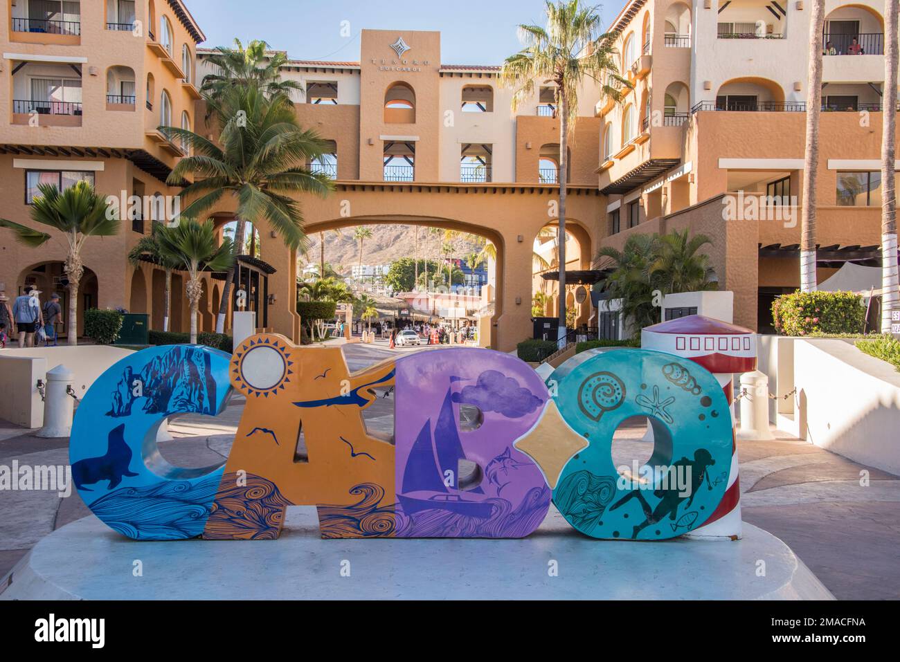 This colorful concrete sign is popular with tourists. Everyone has to ...