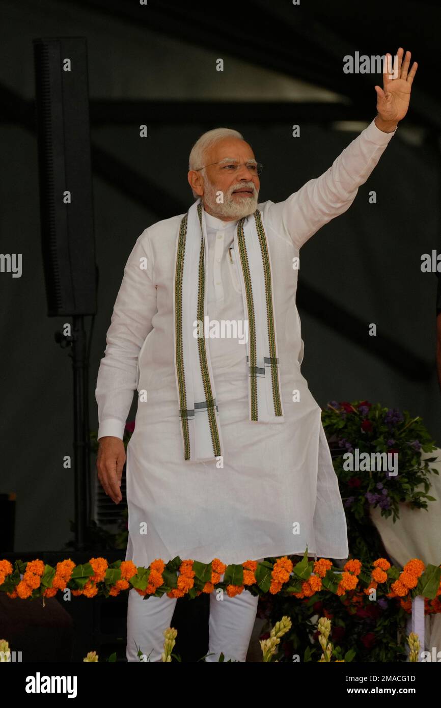Indian Prime Minister Narendra Modi waves during the flagging off of ...
